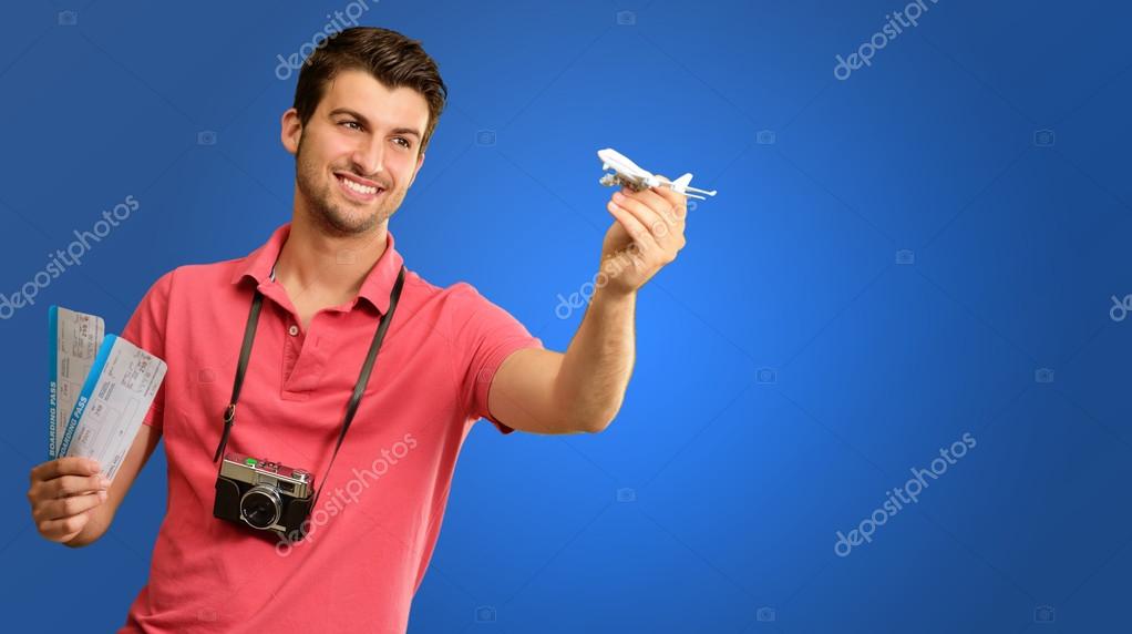Man holding boarding pass and airplane Stock Photo by ©Krakenimages.com ...