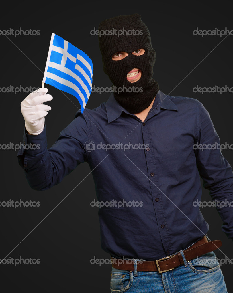 Man wearing robber mask and holding flag — Stock Photo © Krakenimages ...