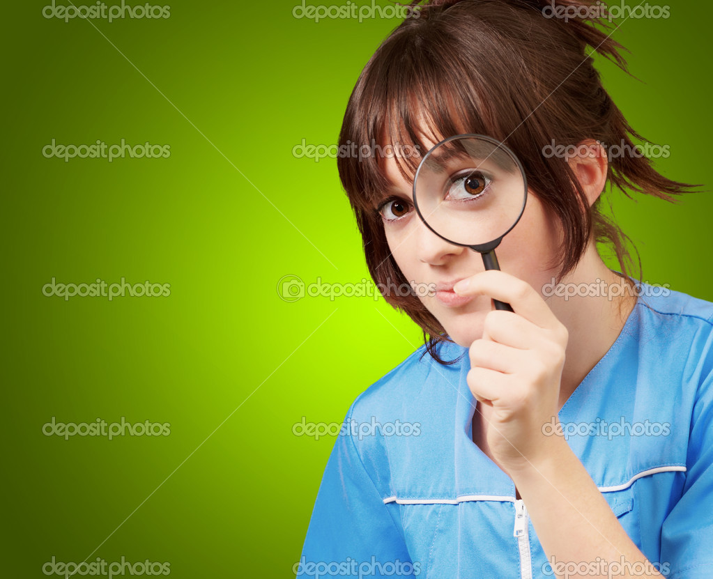 Woman looking through magnifying glass Stock Photo by ©Krakenimages.com ...
