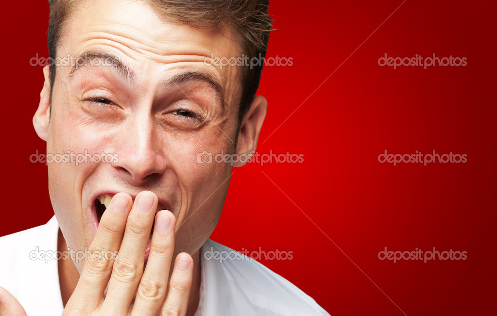 "Portrait Of Young Man Covering His Mouth With Hand " Stock Photo by ...