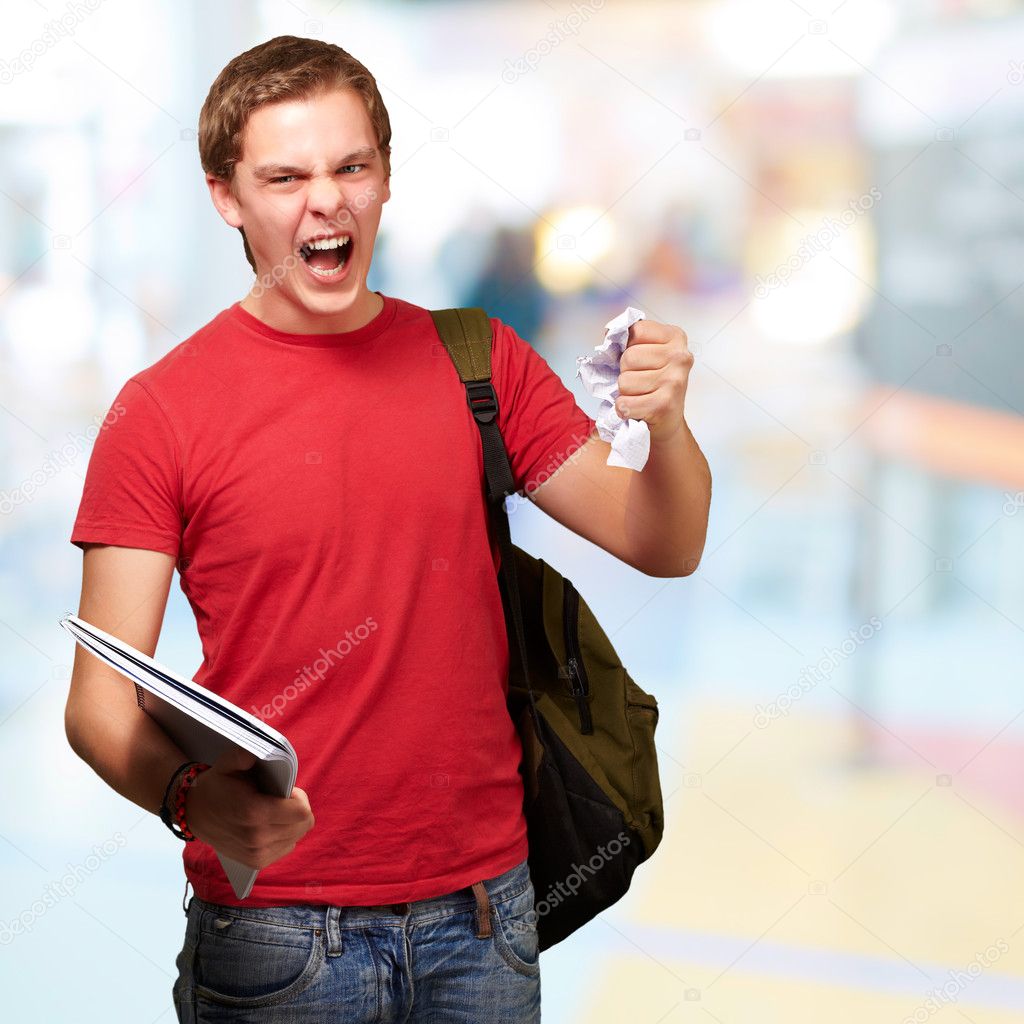 Young angry student man roughing a sheet at classroom Stock Photo by ...