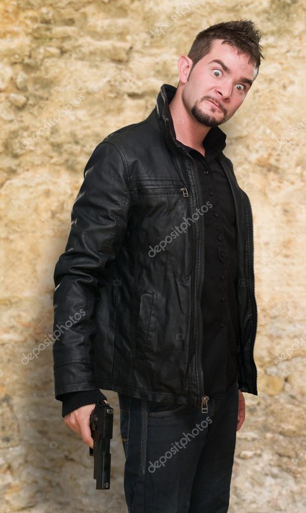 crazy man holding a gun — Stock Photo © coolfonk #16298527