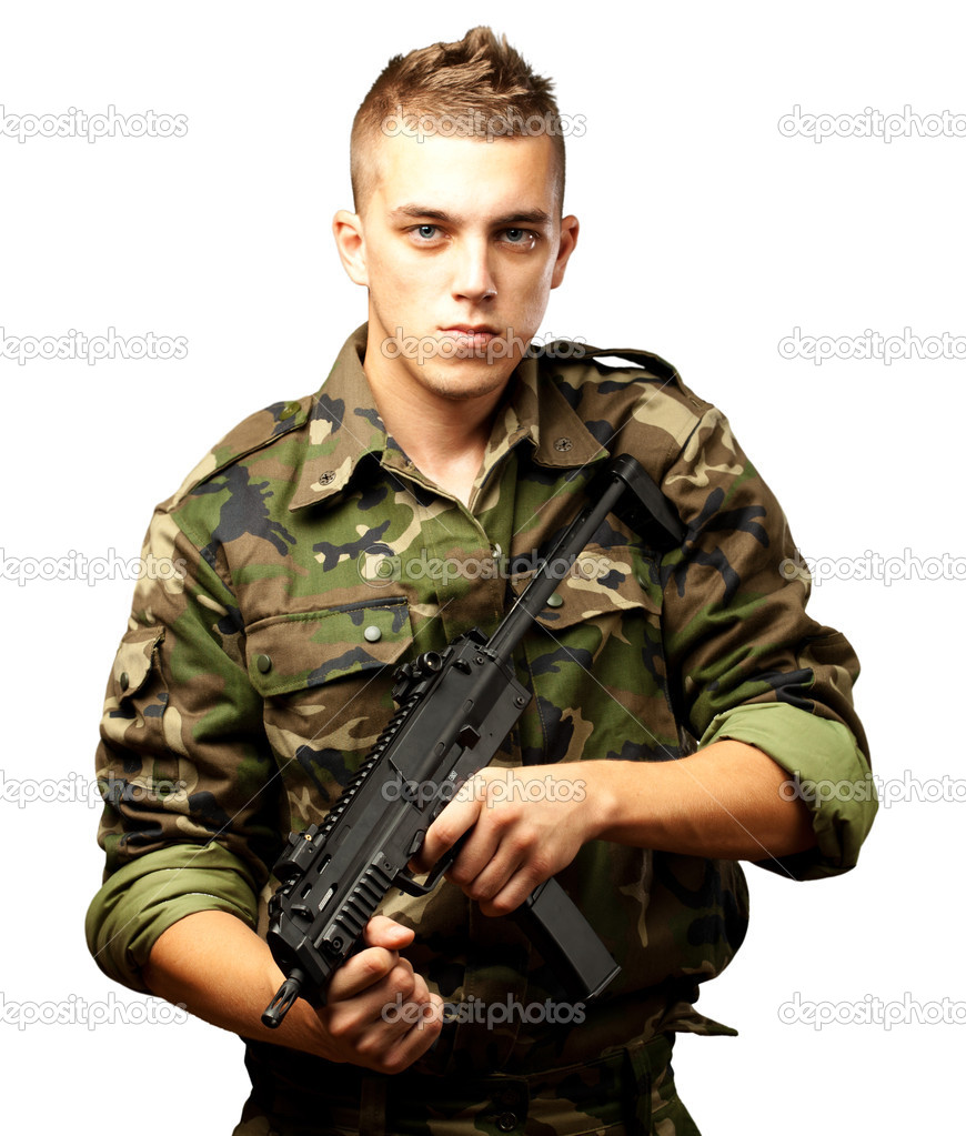 Handsome soldier holding gun Stock Photo by ©Krakenimages.com 19515187
