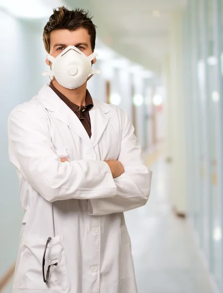 Young Doctor Wearing Mask With Hands Folded - Stock Image - Everypixel