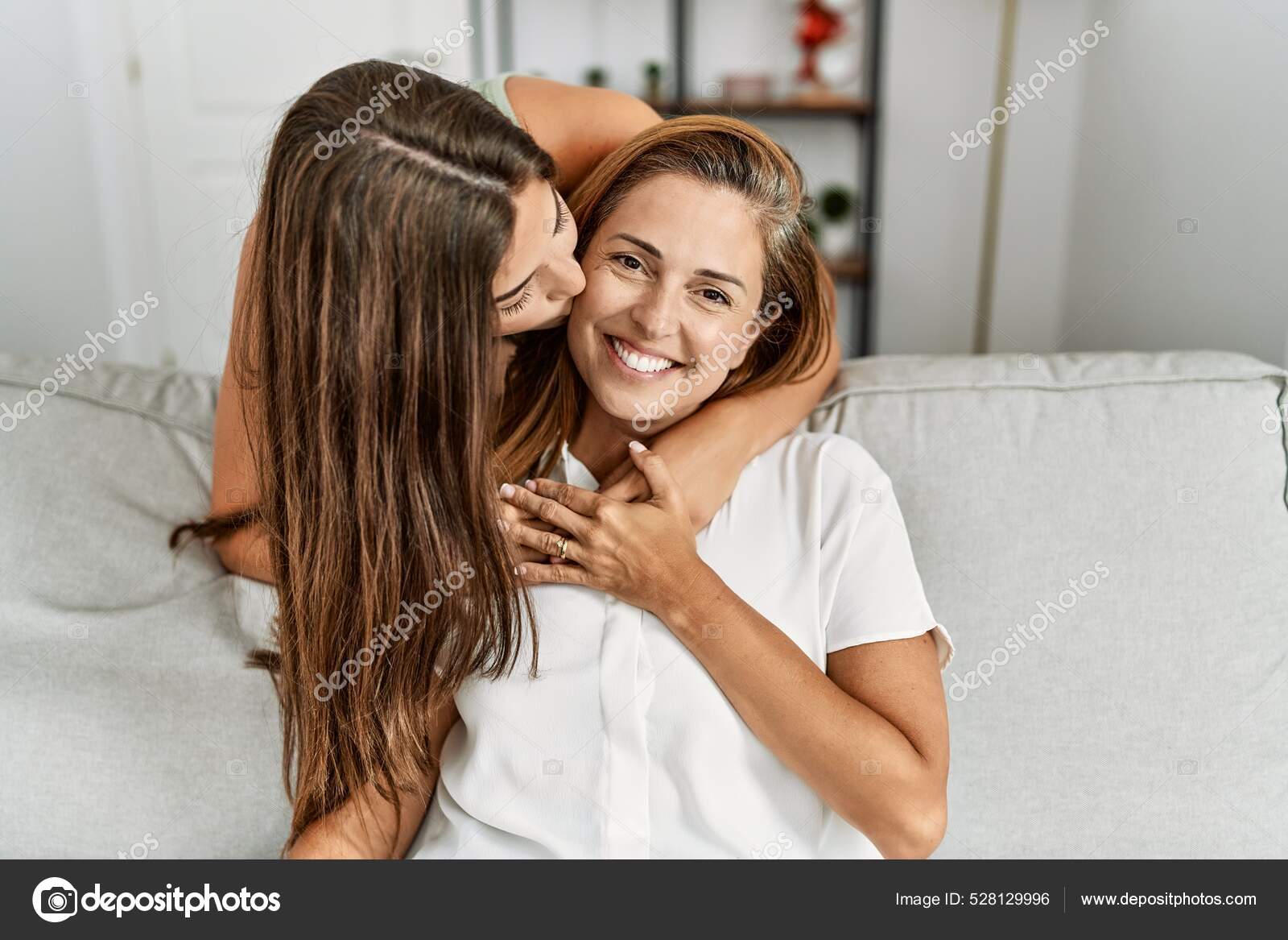 Mother Daughter Kissing Hugging Each Other Sitting Sofa Home — Stock Photo © Krakenimages.com ...