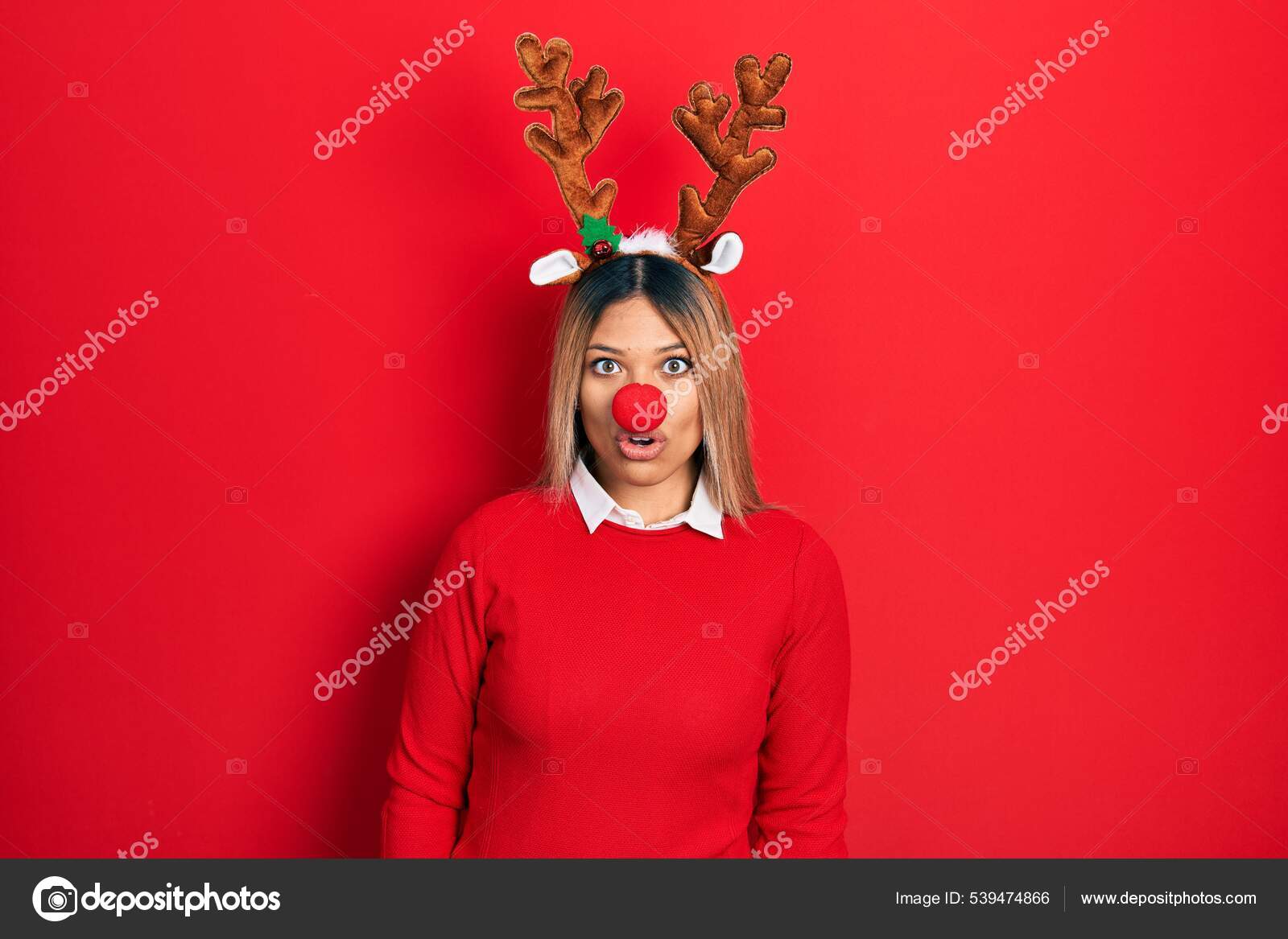 Beautiful Hispanic Woman Wearing Deer Christmas Hat Red Nose Afraid
