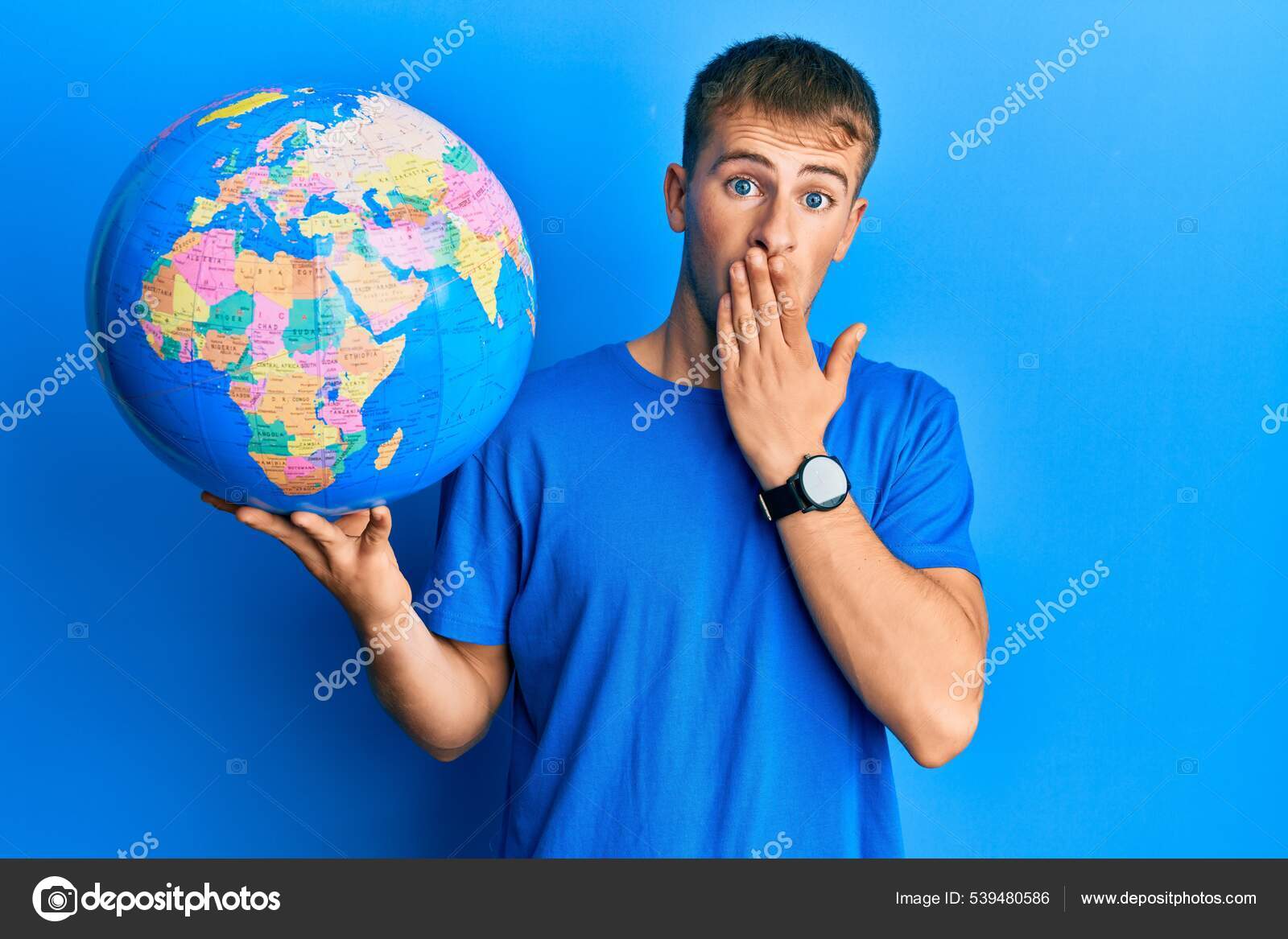Young Caucasian Man Holding World Ball Covering Mouth Hand Shocked ...