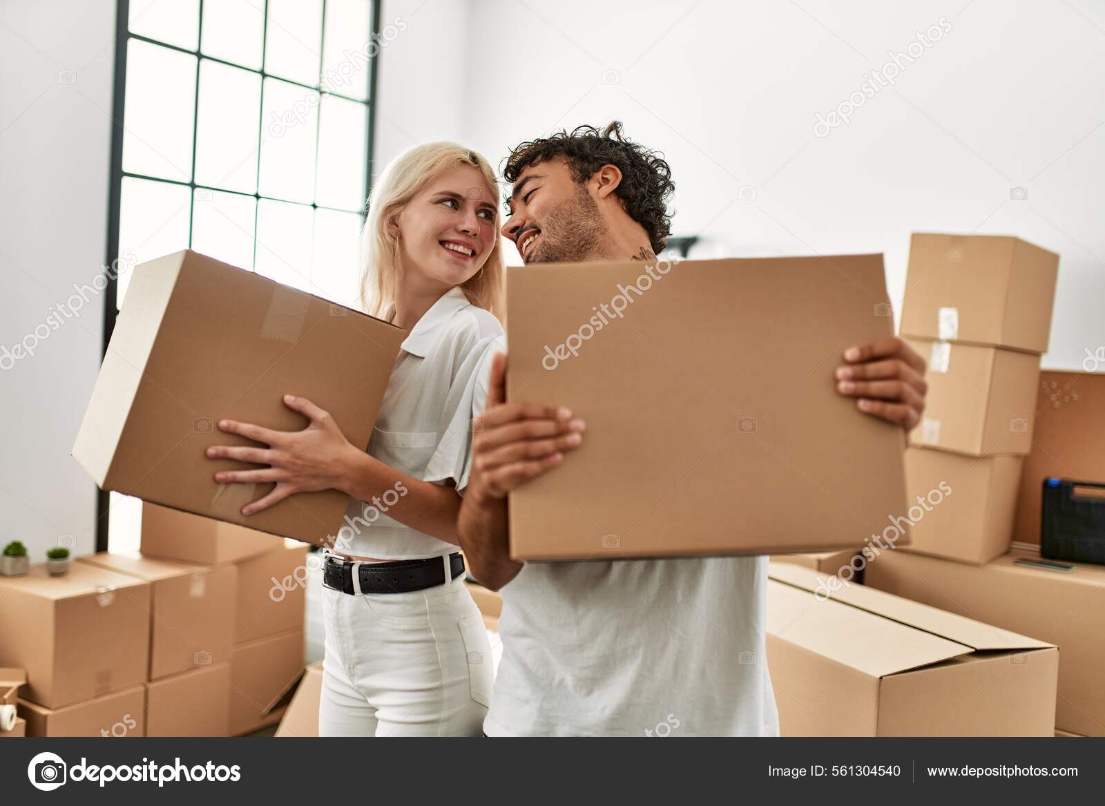 Young Beautiful Couple Smiling Happy Holding Cardboard Boxes New Home