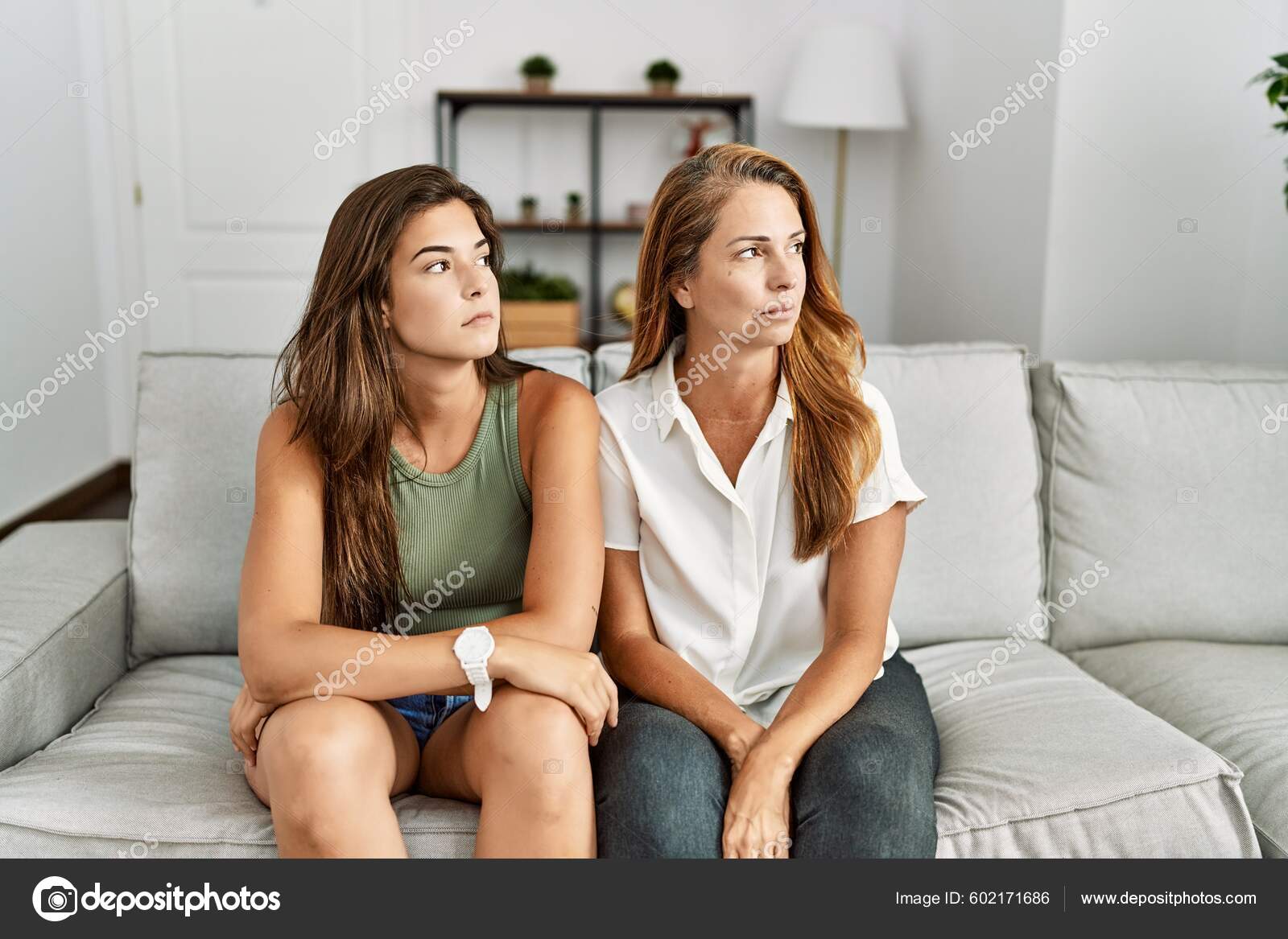 Mother Daughter Together Sitting Sofa Home Looking Side Relax Profile