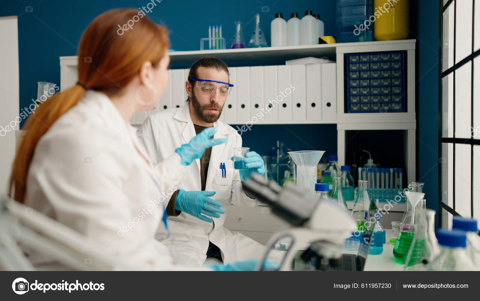 Man Woman Wearing Sciencist Uniform Using Microscope Laboratory Stock ...