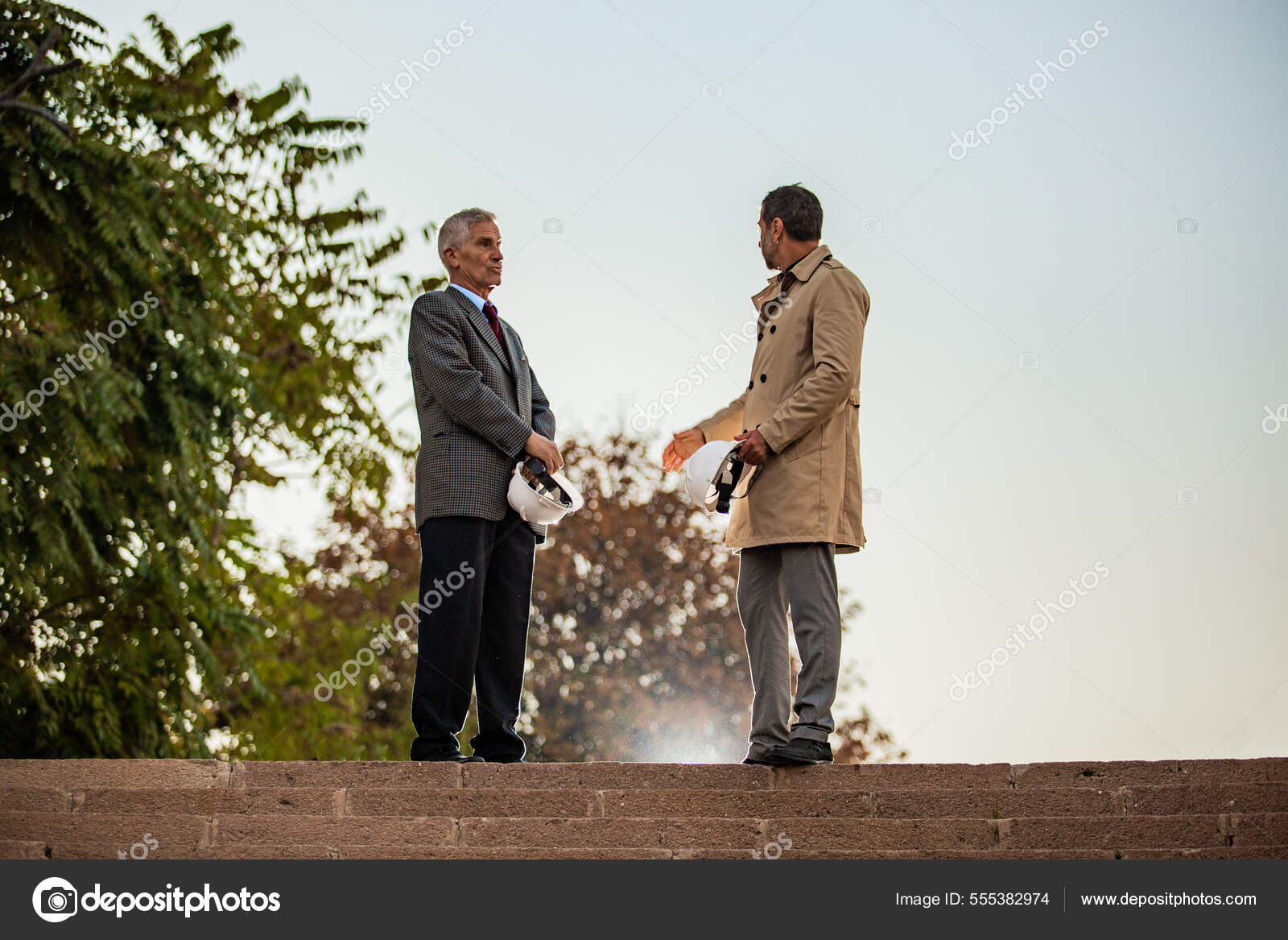 Two Senior Businessmen Talking While Standing Stairs — Stock Photo ...