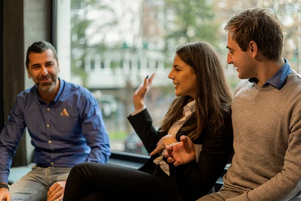 Group of amazing business people are laughing together in the cafe ...