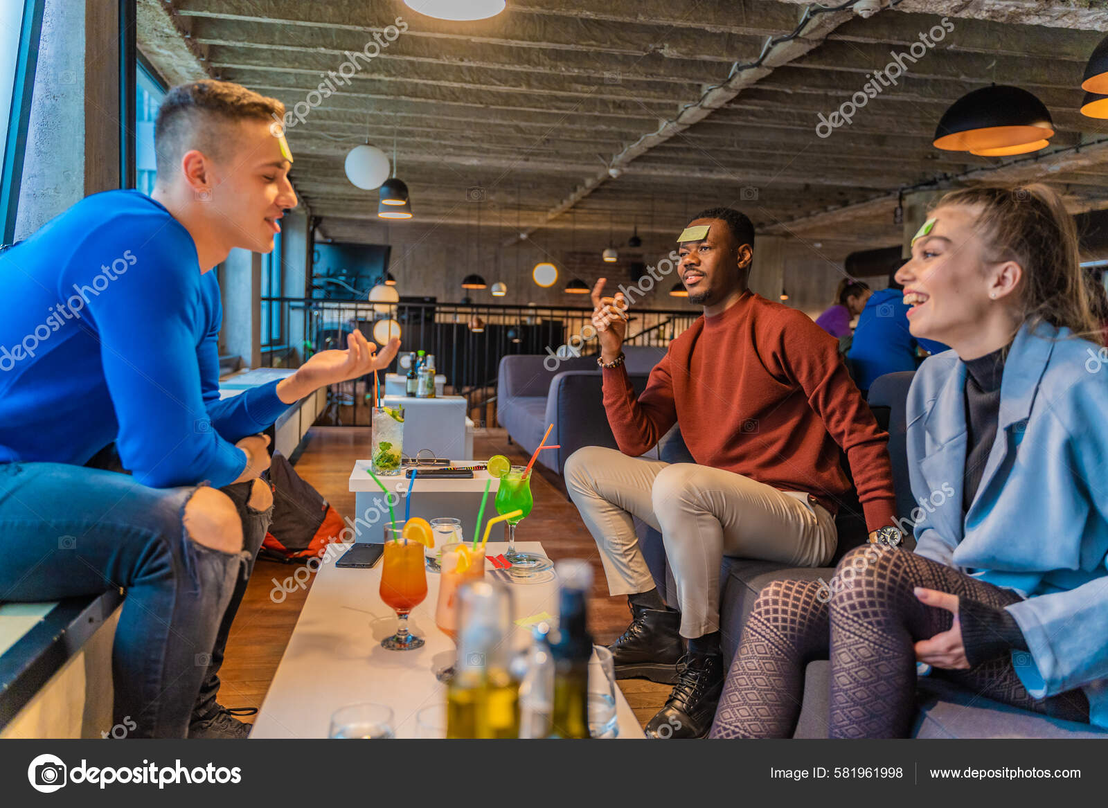 Multiracial Friends Laughing Guessing Word While Thinking — Stock Photo ...