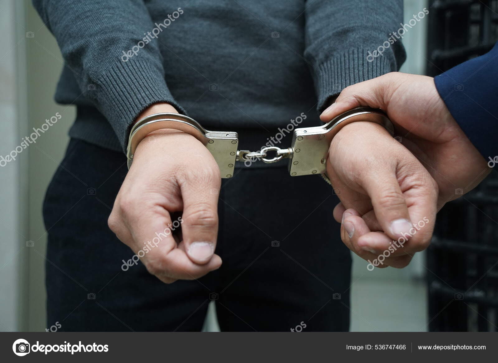 Police Officer Handcuffs Suspect — Stock Photo © LyazaTretyakova #536747466 Police Officer Handcuffs Suspect — Stock Photo © LyazaTretyakova #536747466