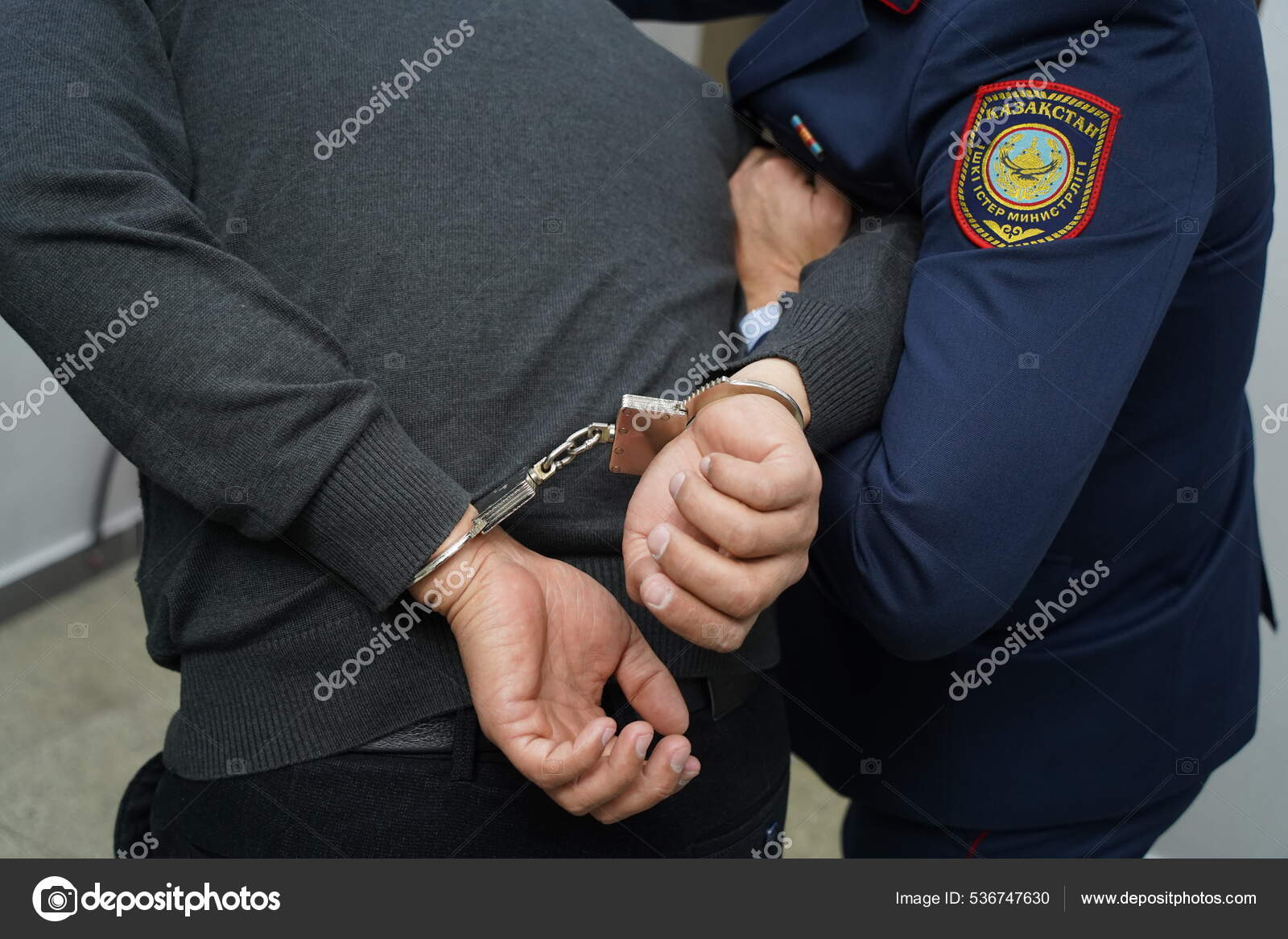 Police Officer Handcuffs Suspect — Stock Photo © LyazaTretyakova #536747630 Police Officer Handcuffs Suspect — Stock Photo © LyazaTretyakova #536747630