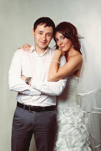Bride and groom wedding photo taken in the studio on a black background ...