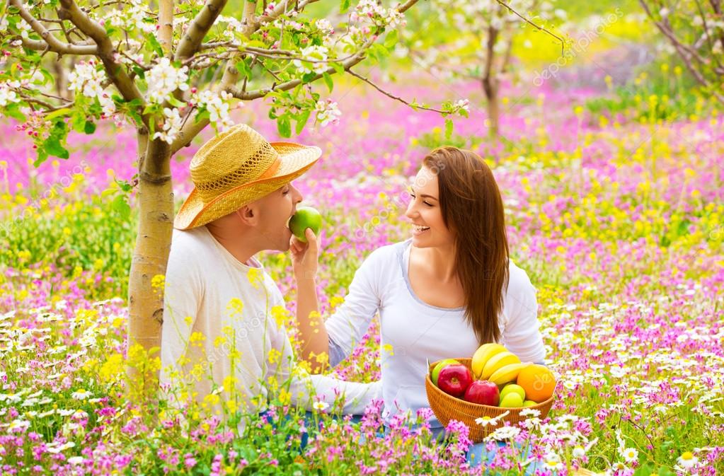 Young family in spring garden Stock Photo by ©Anna_Om 25185995