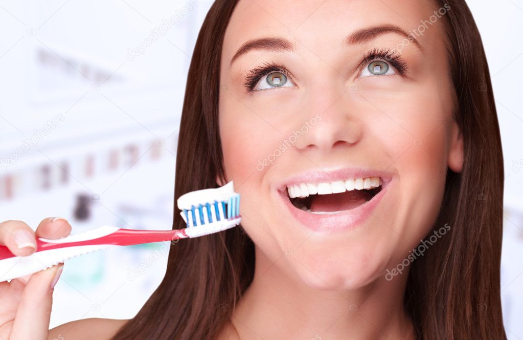 Beautiful woman clean teeth — Stock Photo © Anna_Om #32680801
