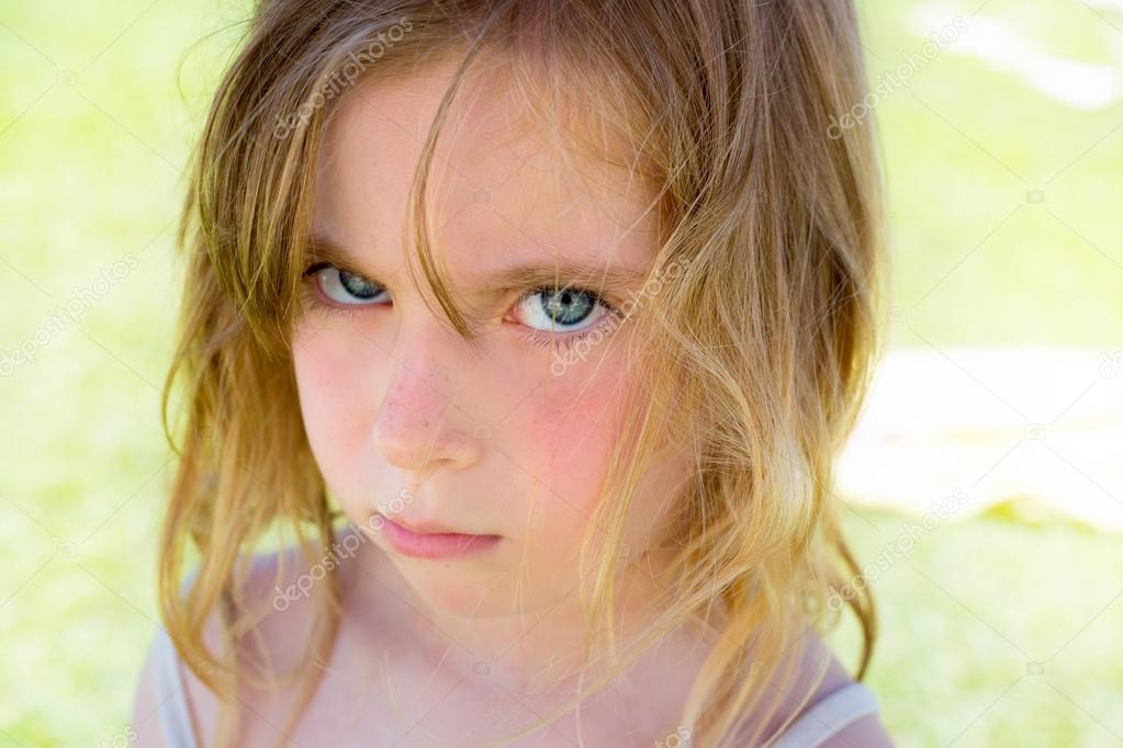 Angry blond children girl portrait looking camera — Stock Photo ...