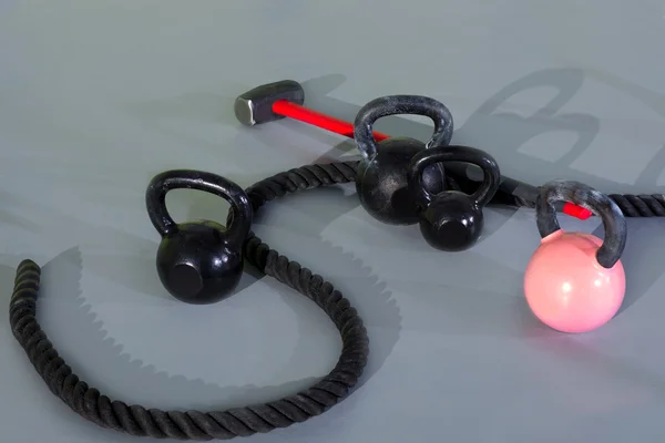 Crossfit Kettlebell and battle rope at gym — Stock Photo © lunamarina ...