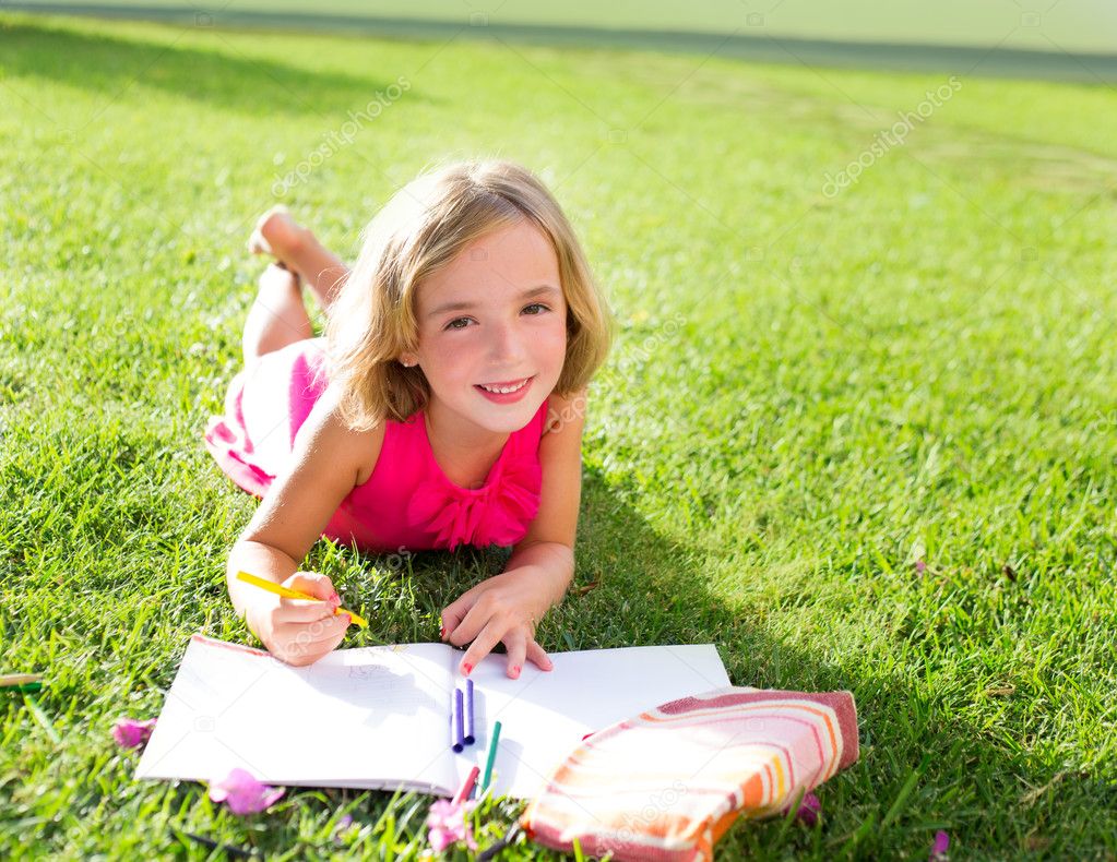 Child kid girl doing homework smiling happy on grass — Stock Photo ...