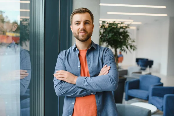 Portrait of young man near in window. - Stock Image - Everypixel