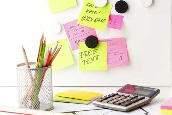 Desk with 'Post It' notes Stock Photo by ©gzorgz 27047071