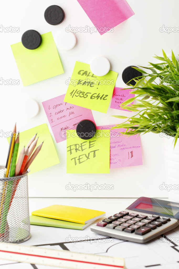 Desk with 'Post It' notes Stock Photo by ©gzorgz 27047071
