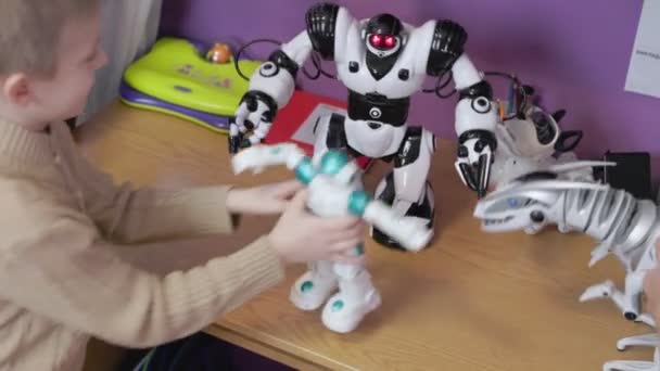 Kids playing with robots Stock Video Footage by ©zokov #556953884