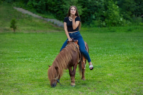 Girl riding pony Stock Photos, Royalty Free Girl riding pony Images ...