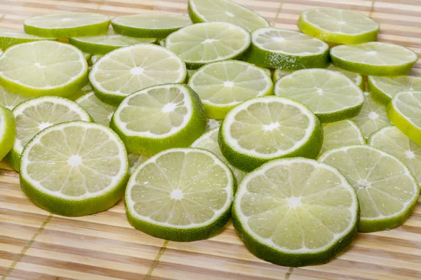 Seamless pattern of green lime slices — Stock Photo © boroda #10657933