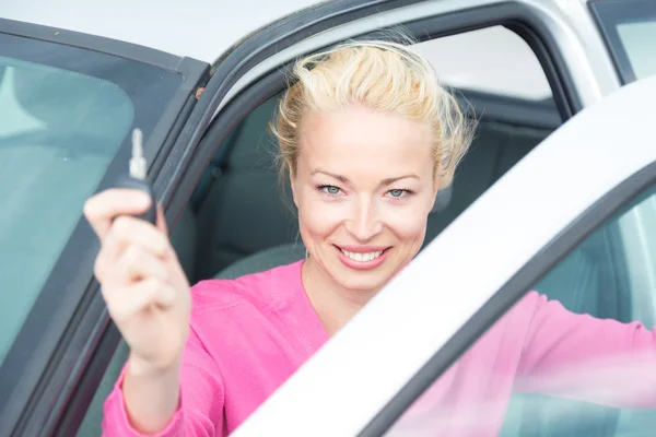 Woman driver showing car keys. - Stock Image - Everypixel