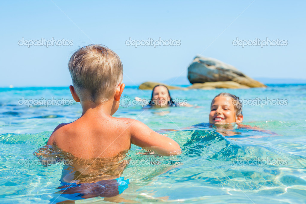 Kids playing in the sea — Stock Photo © mac_sim #21115779