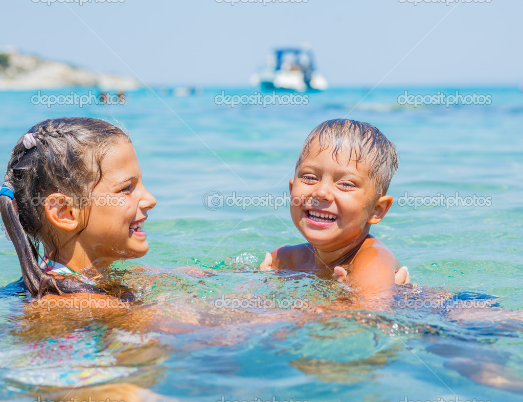 Kids playing in the sea Stock Photo by ©mac_sim 21463225