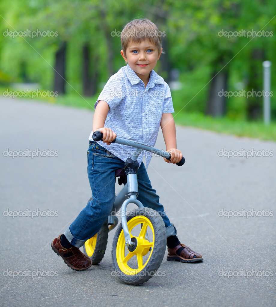Little boy on a bicycle Stock Photo by ©mac_sim 25078231