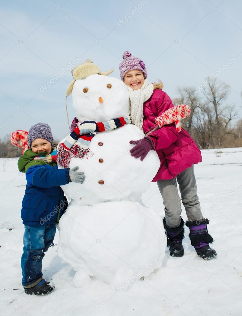 Kids Making A Snowman