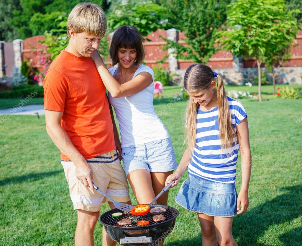 Family having barbecue Stock Photo by ©mac_sim 45573977
