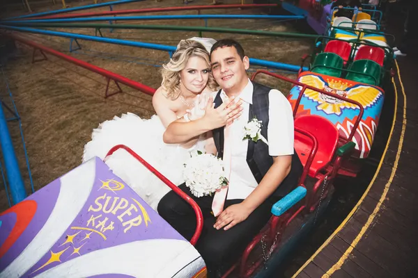 Married couple riding on Ferris wheel and kissing — Stock Photo ...