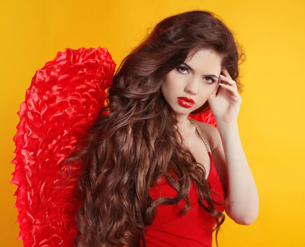 Beautiful female angel model posing with red wings in dress isol Stock ...