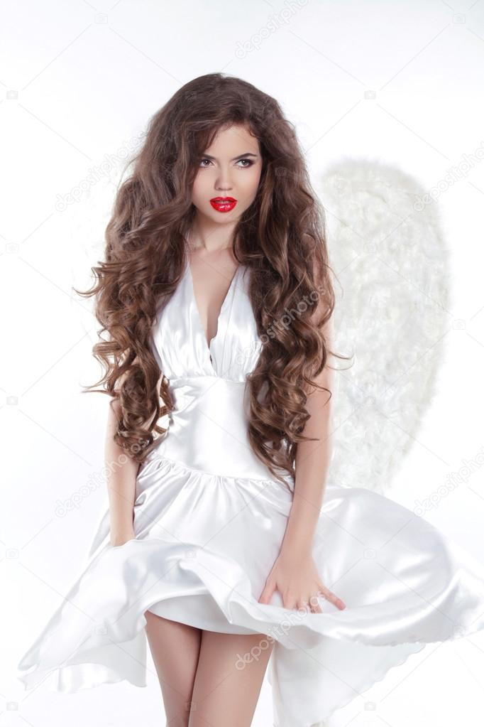 Long wavy Hair. Model Angel Girl in blowing dress with white win Stock ...