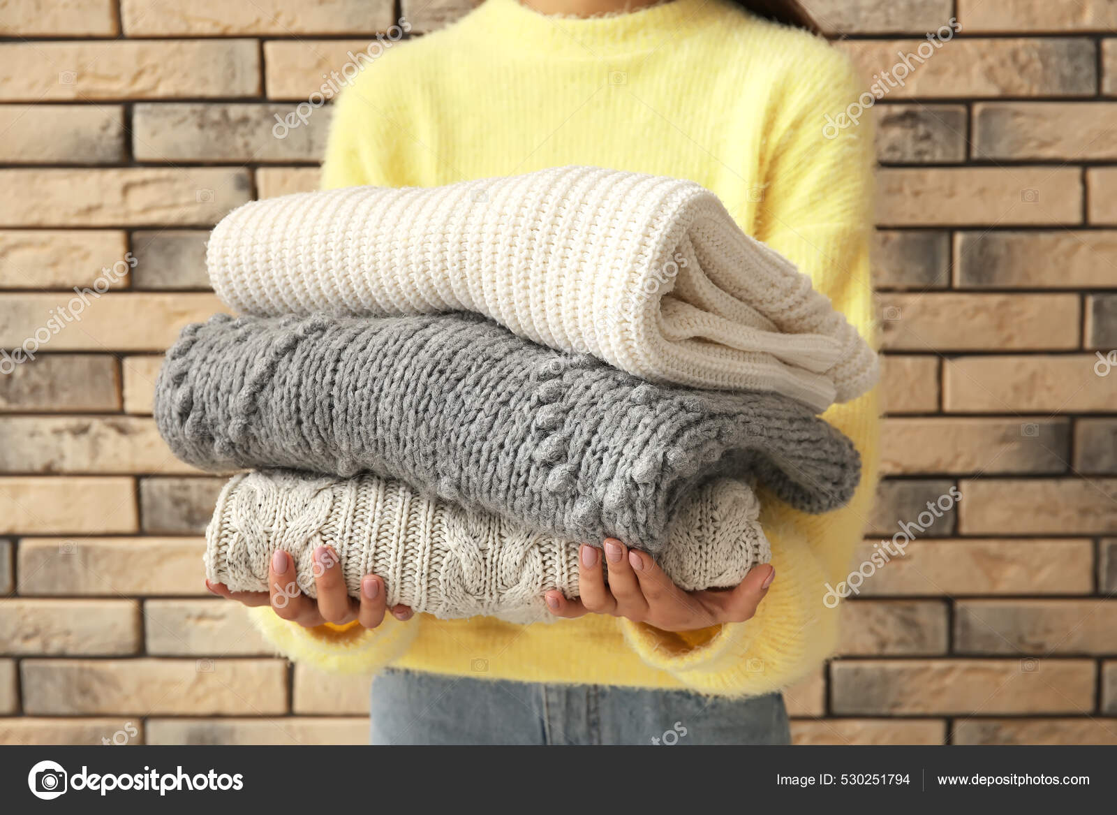 Woman Holding Stack Knitted Sweaters Brick Wall Background — Stock ...