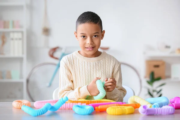 Little Girl Playing Pink Pop Tube Home Closeup Stock Photo by ©serezniy ...