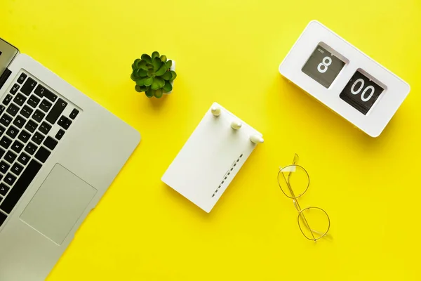 Router Clock Laptop Color Background Stock Photo by ©serezniy 545058194