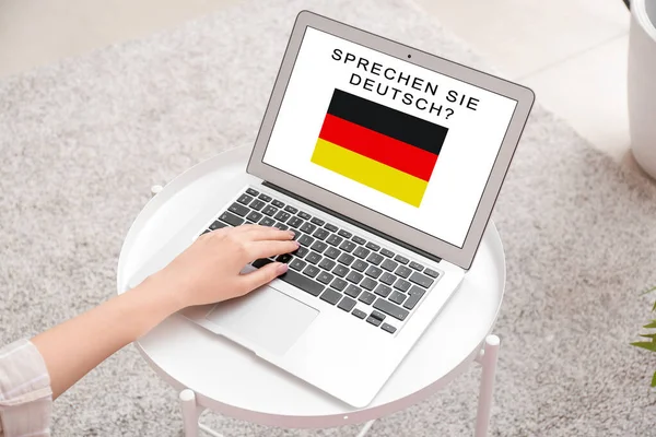 Woman using laptop with text SPRECHEN SIE DEUTSCH? (DO YOU SPEAK GERMAN ...