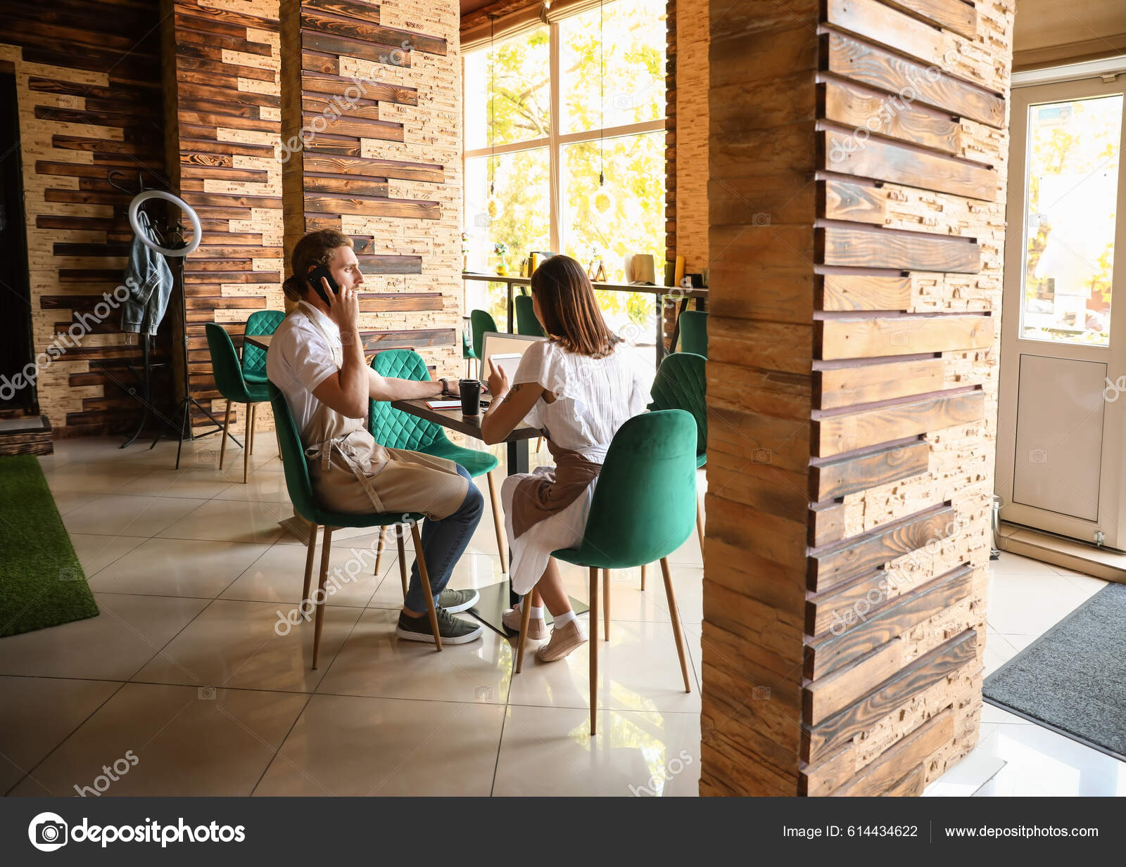 Business Owners Working Table Cafe Stock Photo by ©serezniy 614434622