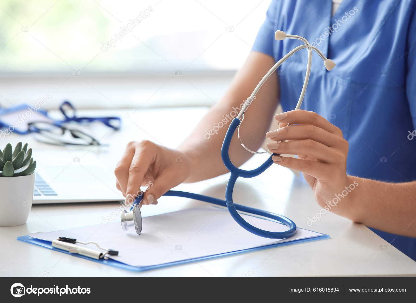 Female Doctor Stethoscope Sitting Table Medical Office Closeup — Stock Photo © serezniy #616015894