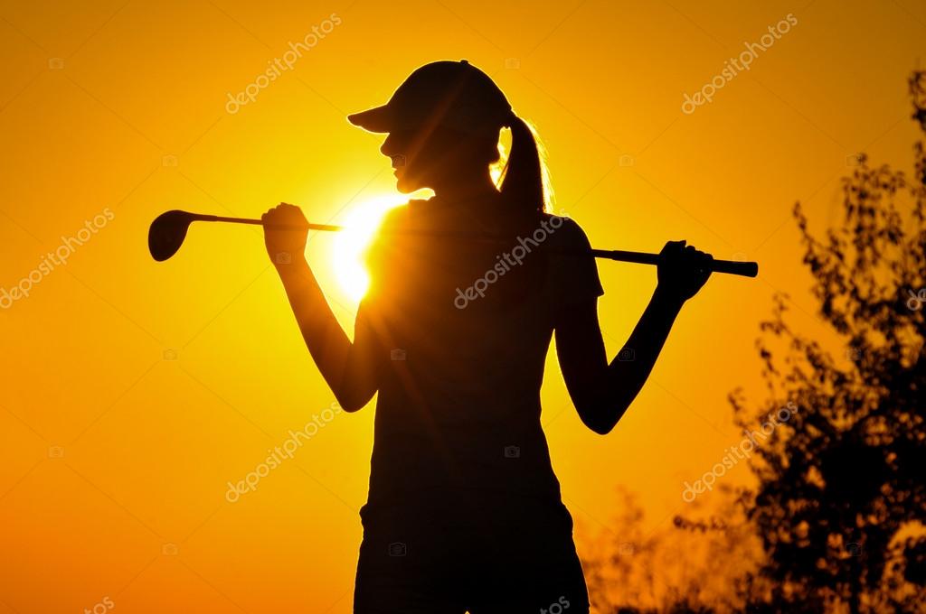 Girl playing golf on the sunset — Stock Photo © zorandim #13970130