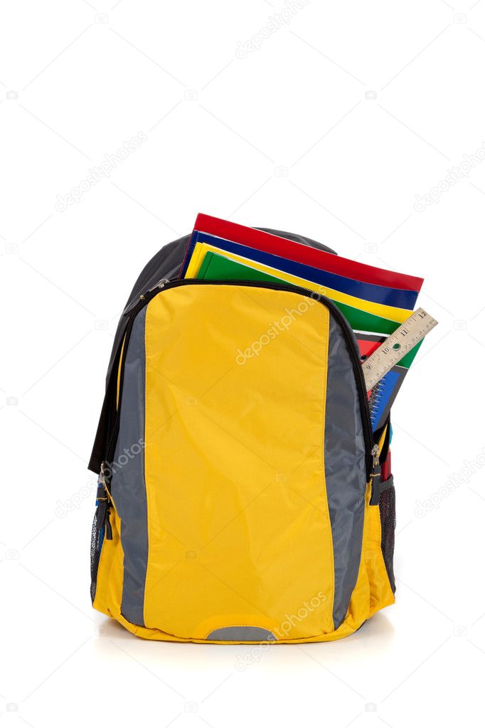 Yellow backpack with school supplies Stock Photo by ©miflippo 13409769