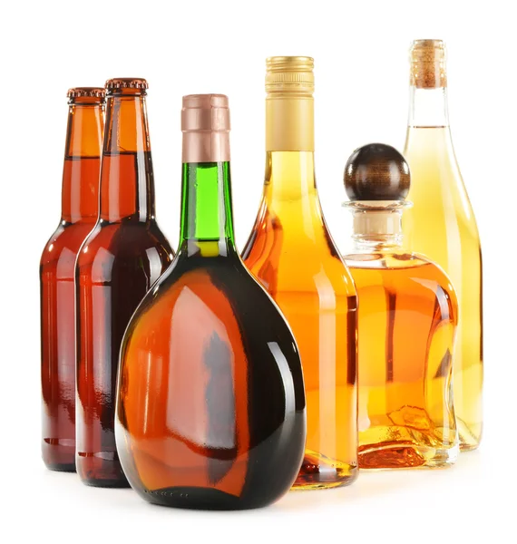 Bottles of assorted alcoholic beverages isolated on white Stock Photo ...