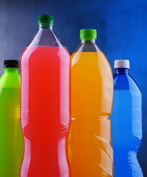 Plastic bottles of assorted carbonated soft drinks — Stock Photo ...